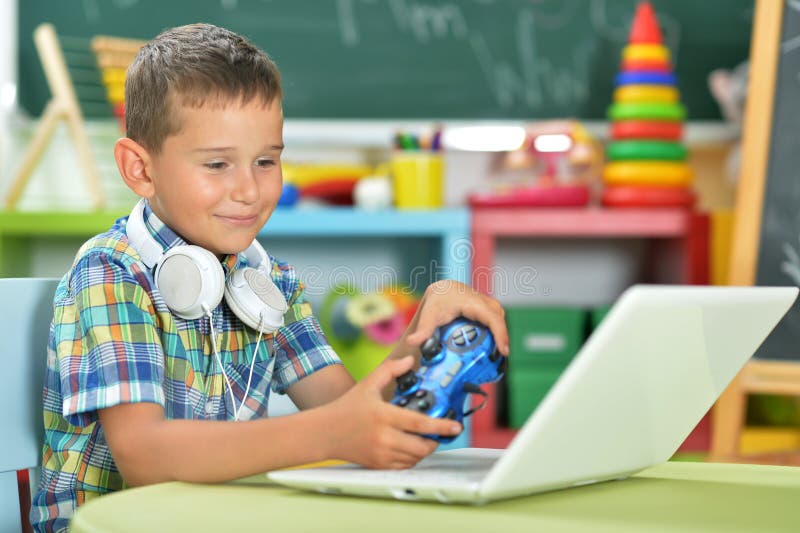 Portrait of Emotional Boy Playing Computer Game with Laptop Stock Image ...