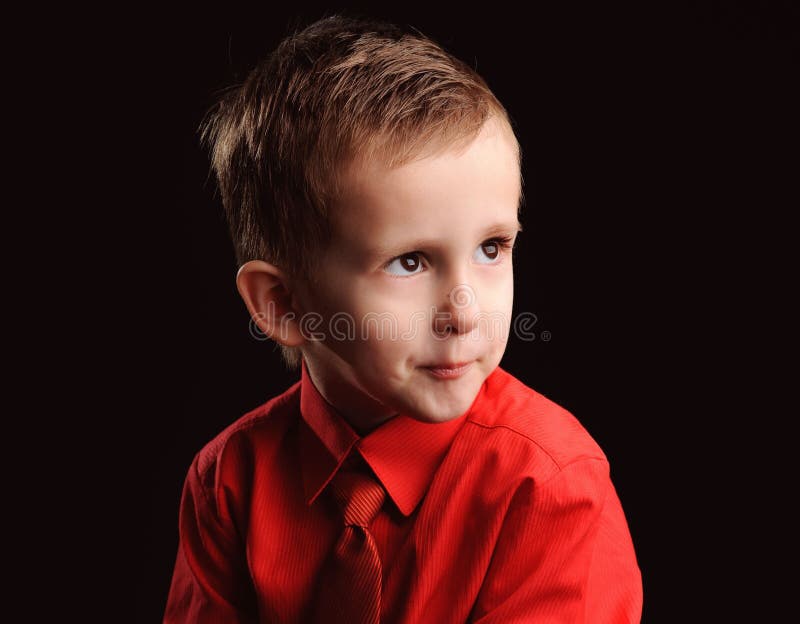 Emotional boy in red shirt stock photo. Image of happy - 157081222