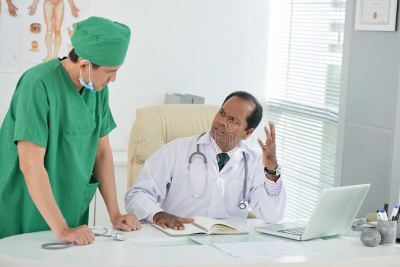 Emotional Conversation of Doctors Stock Image - Image of serious ... Emotional Conversation of Doctors Stock Image - Image of serious ...