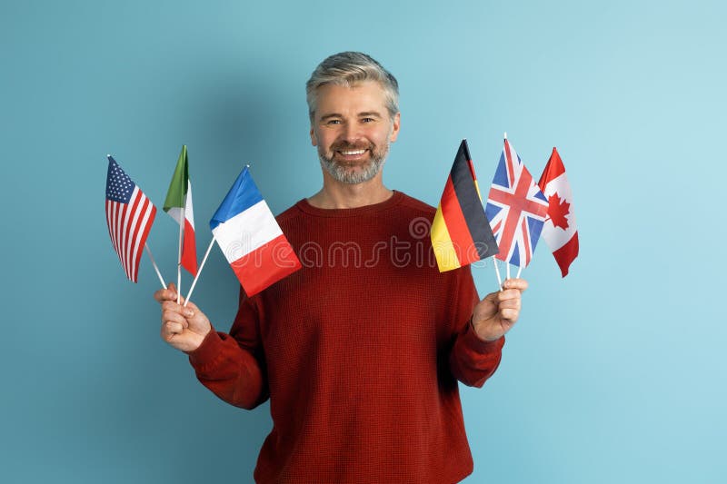 Emotional Handsome Middle Aged Man Holding Flags of Diverse Countries ...