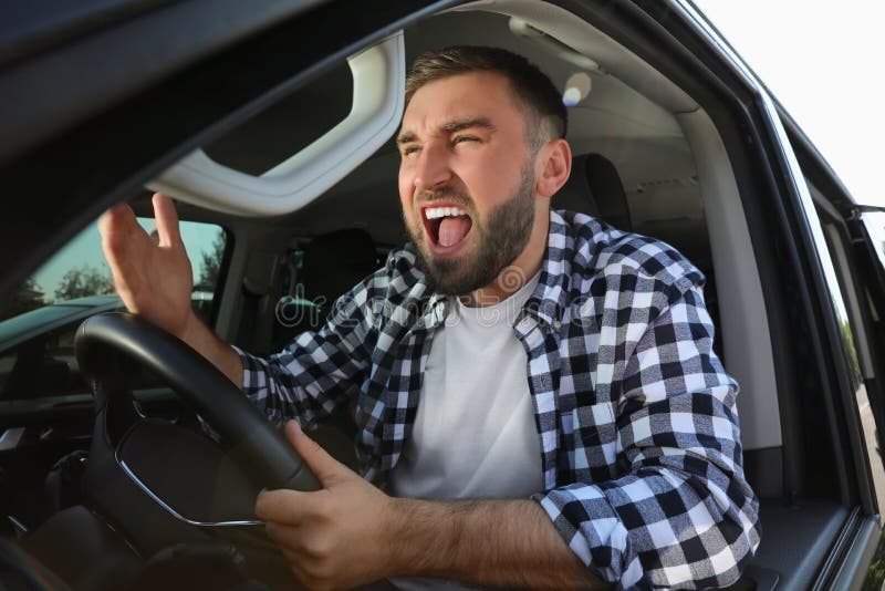 Emotional Man in Car. Aggressive Driving Behavior Stock Image - Image ...