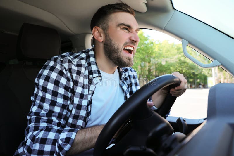 Emotional Man in Car. Aggressive Driving Behavior Stock Image - Image ...