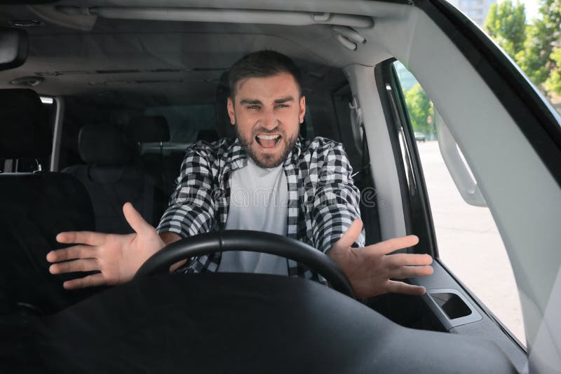 Emotional Man in Car. Aggressive Driving Behavior Stock Image - Image ...
