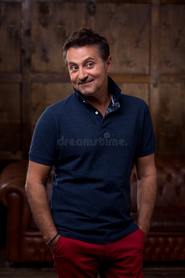 Emotional Man Smiling and Looking Curious while Standing Alone Stock ...