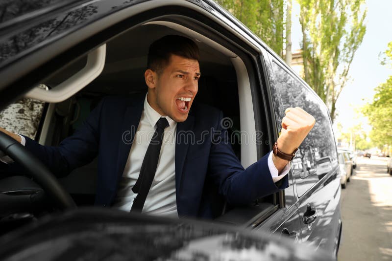 Emotional Man Yelling in Car. Aggressive Driving Behavior Stock Photo ...