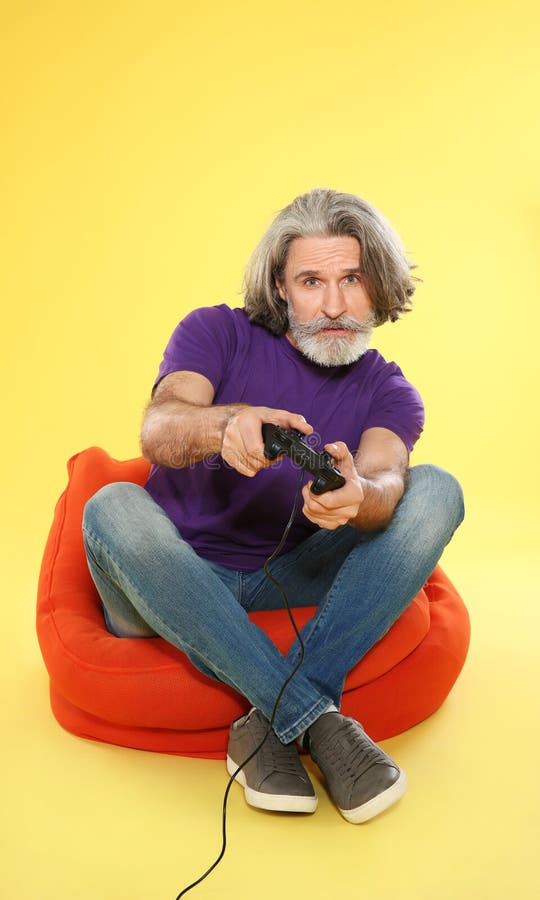 Emotional Mature Man Playing Video Games with Controller Stock Image ...