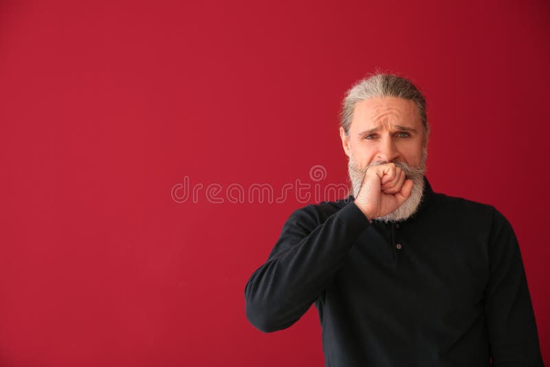 Emotional Senior Man after Making Mistake on Color Background Stock ...