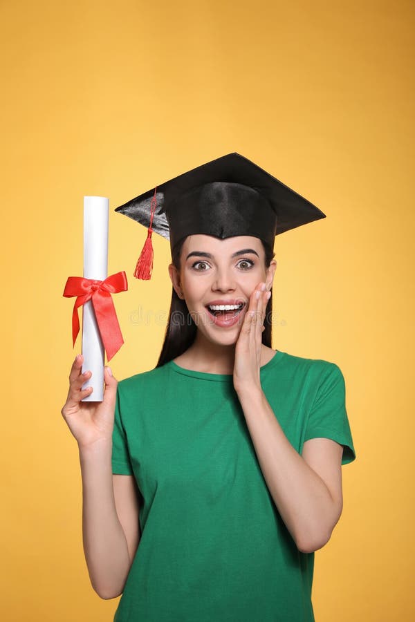 Emotional Student with Graduation Hat and Diploma on Yellow Background ... Emotional Student with Graduation Hat and Diploma on Yellow Background ...