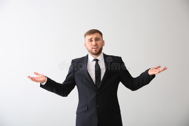 Emotional Young Businessman after Making Mistake on White Background ...