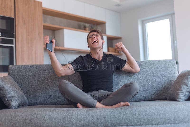 Emotional Young Man Listening To His Favorite Songs Sitting On The