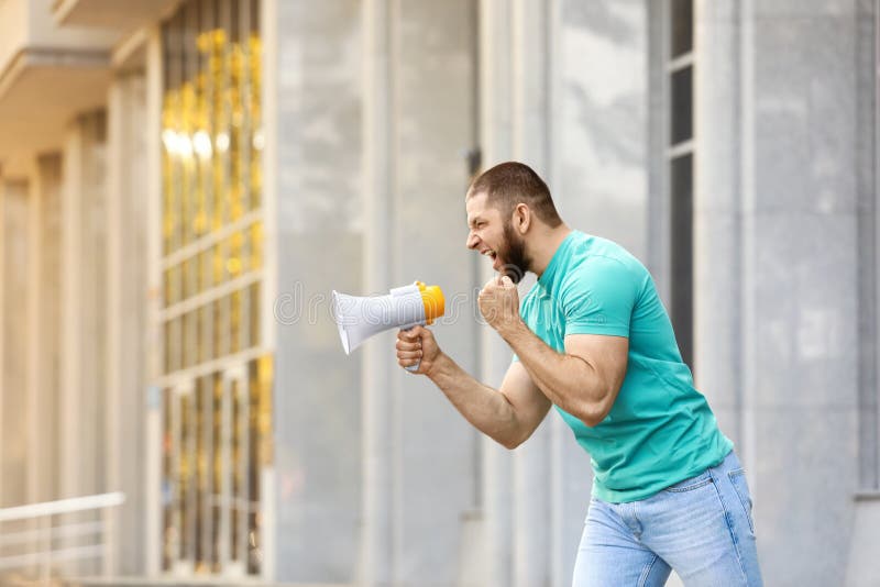 Protest Leader with Megaphone Talking To Crowd Outdoors Stock Image ... Protest Leader with Megaphone Talking To Crowd Outdoors Stock Image ...