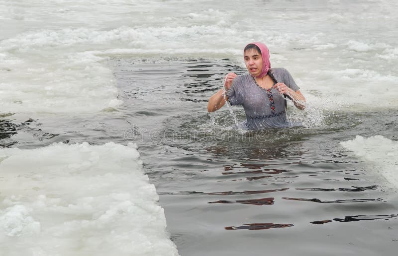 Religious Holiday of Epiphany . People Bathe in Winter in the River ...