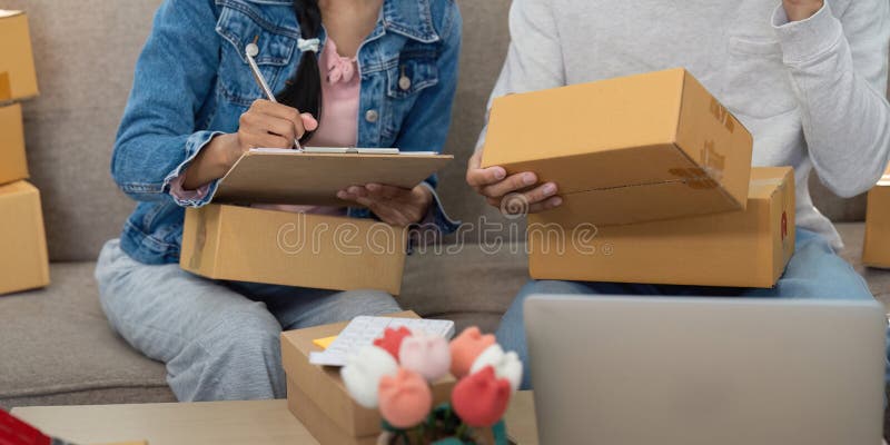 E-commerce Success and Planning. a Couple Working Together To Manage ...