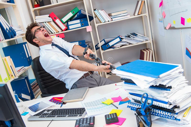 The Employee Attached and Chained To His Desk with Chain Stock Photo ...