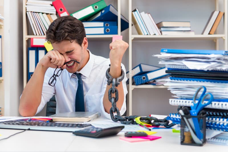 The Employee Attached and Chained To His Desk with Chain Stock Image ...