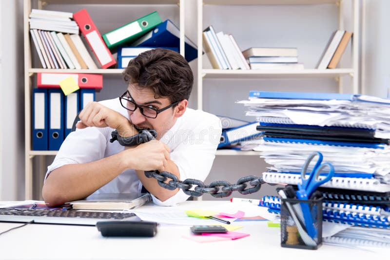 The Employee Attached and Chained To His Desk with Chain Stock Image ...