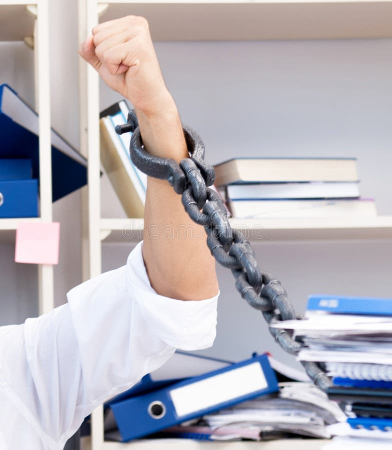Employee Attached and Chained To His Desk with Chain Stock Photo ...