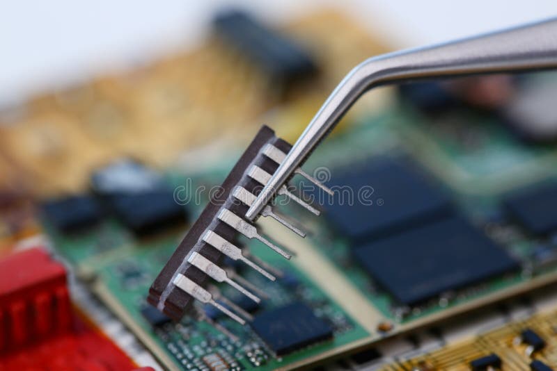 Processor in the tweezers stock image. Image of chip - 59657469