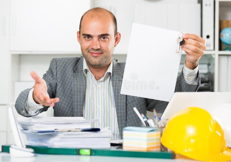 Employee Sitting Near Helmet at the Table Stock Image - Image of ...