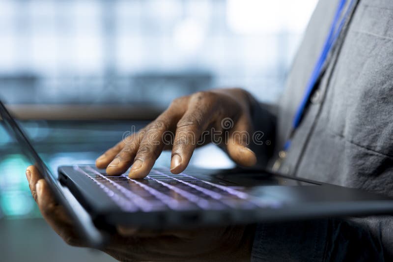 Employee in Data Center Typing on Laptop Keyboard, Analyzing Metrics ...