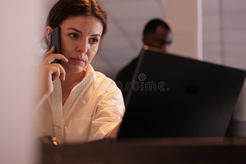 Employee Discussing Report on Smartphone, Checking Data on Website ...