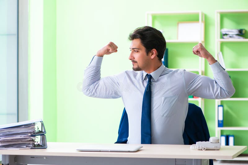 The Employee Doing Exercises during Break at Work Stock Photo - Image ...