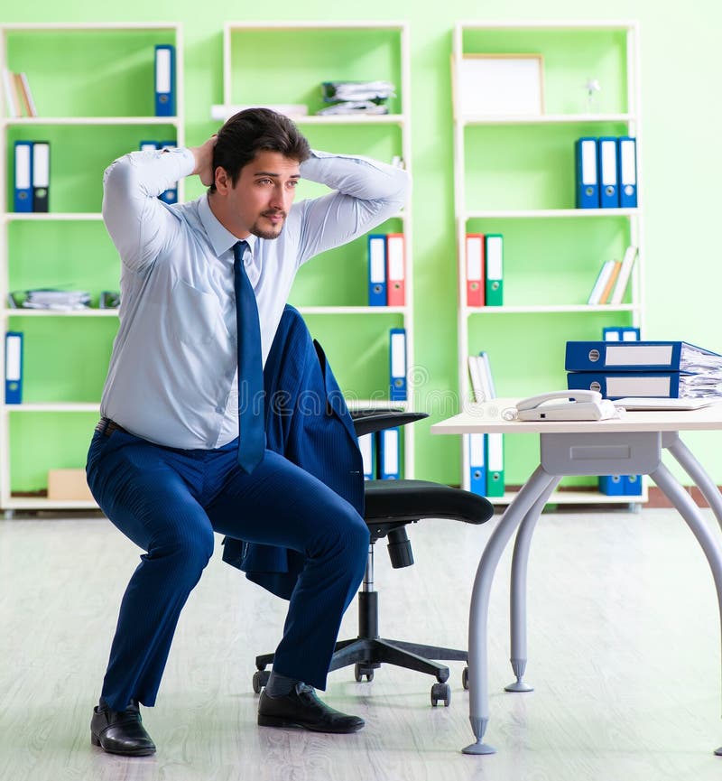 Employee Doing Exercises during Break at Work Stock Image - Image of ...