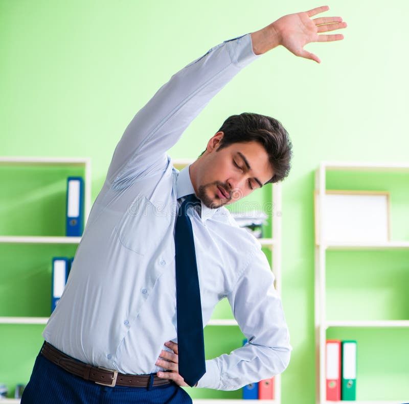 Employee Doing Exercises during Break at Work Stock Image - Image of ...