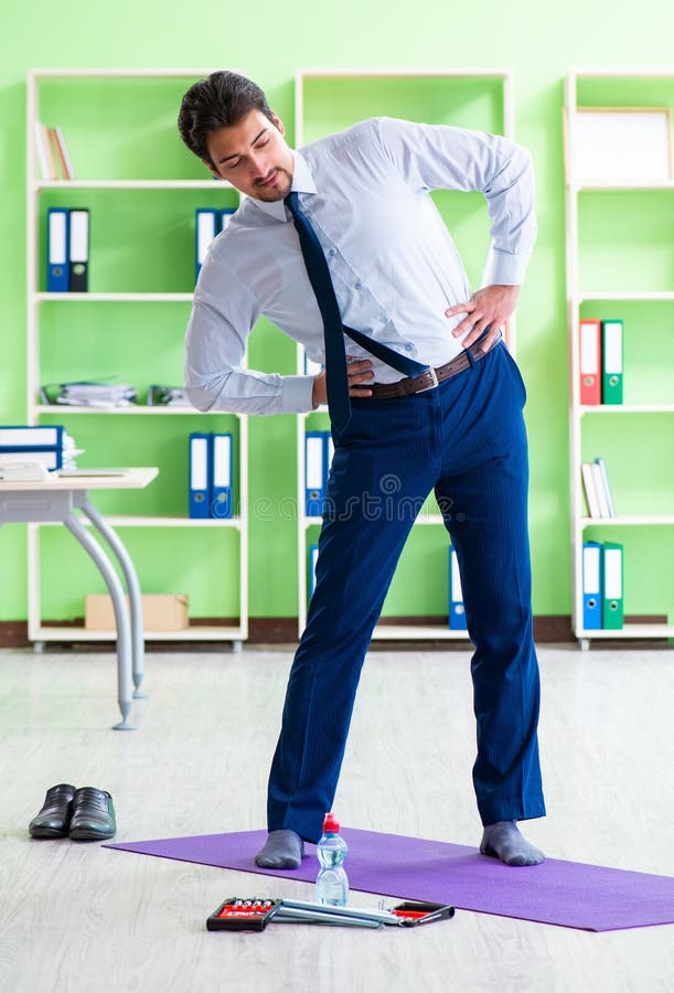Employee Doing Exercises during Break at Work Stock Image - Image of ...
