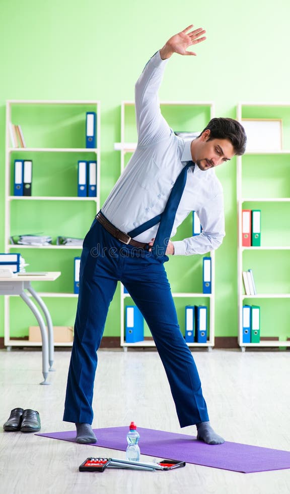 Employee Doing Exercises during Break at Work Stock Photo - Image of ...