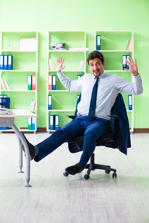 The Employee Doing Exercises during Break at Work Stock Photo - Image ...