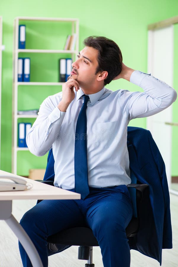 The Employee Doing Exercises during Break at Work Stock Photo - Image ...