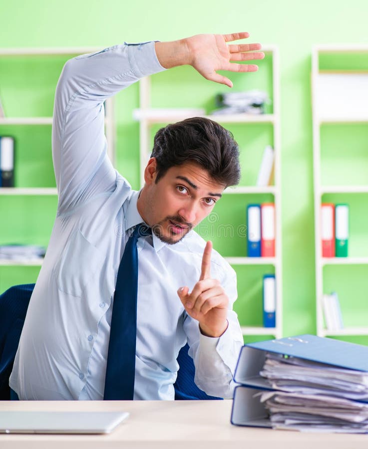 Employee Doing Exercises during Break at Work Stock Photo - Image of ...