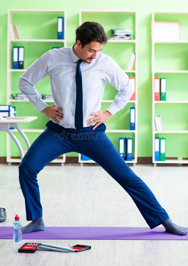 Employee Doing Exercises during Break at Work Stock Image - Image of ...