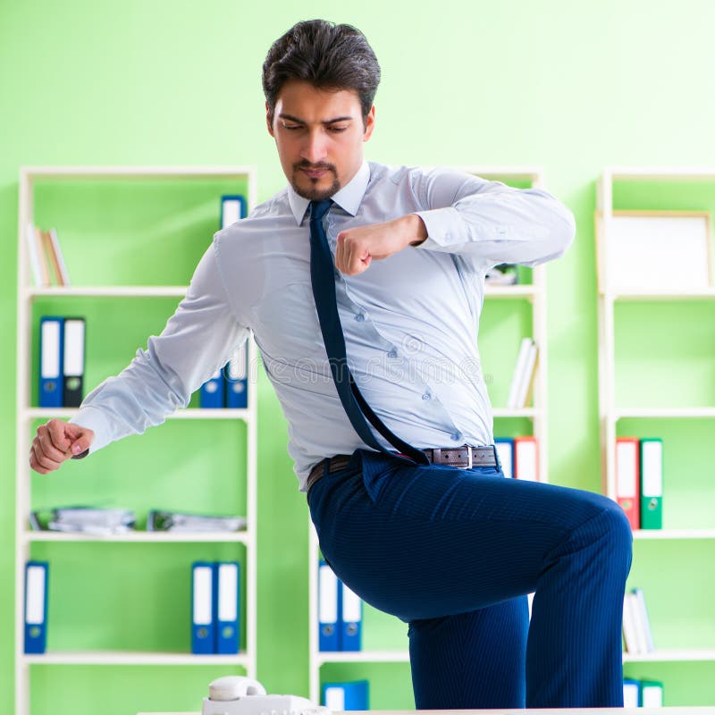 Employee Doing Exercises during Break at Work Stock Photo - Image of ...