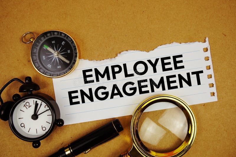 Employee Engagement Text on Paper Torn with Compass and Magnifying ...