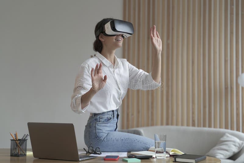 Impressed Business Woman Sitting on Office Table and Using Vr Glasses ...