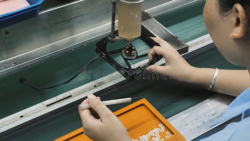 Employee in a Factory of Computer Fans. Stock Image - Image of ...