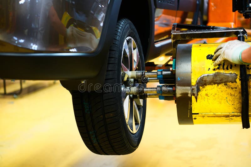 Employee Fastens Car Wheel with Automatic Spanner in Shop Stock Image ...