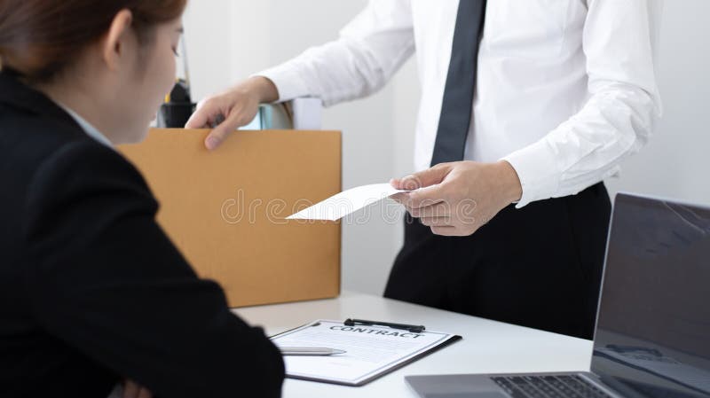 Employee Handed Over a Document Envelope and a Box of Work Equipment ...