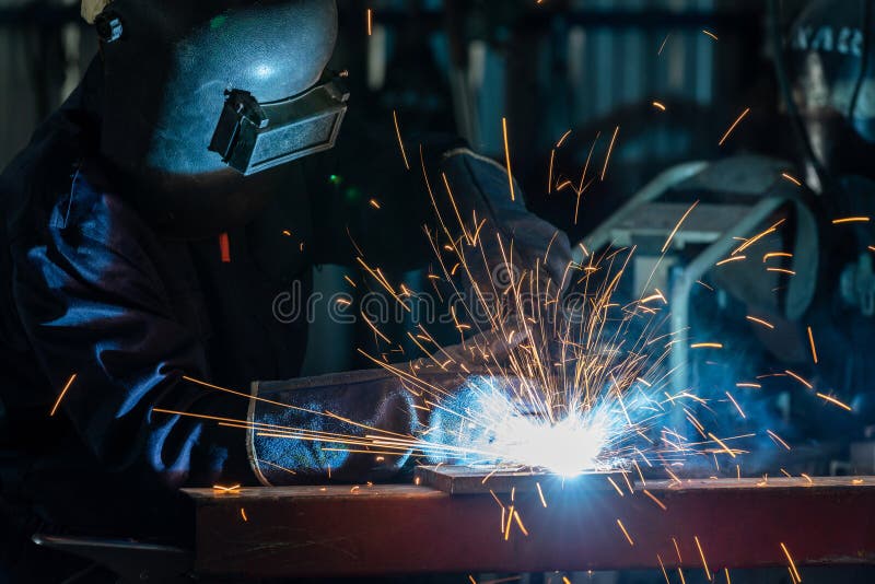 An Employee or Heavy Industrial Worker Inside Factory with Industrial ...