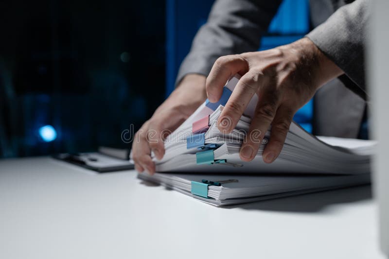An Employee Held a Large Pile of Documents in His Hand, Large Piles of ...