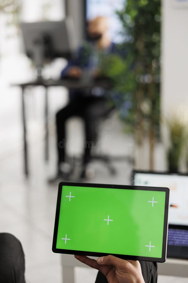 Employee Holding Tablet with Chroma Key Screen while Working Stock ...