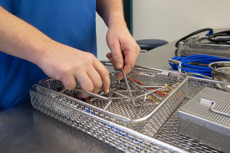 Employee of a Hospital Sterilization Department Sorts the Cleaned ...