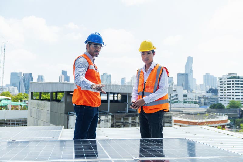 An Employee of a Solar Power Plant Talks on a Walkie-talkie while His ...