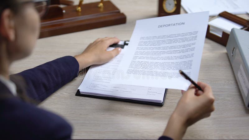 Embassy Employee Approving Visa Application, German Flag on Table ...
