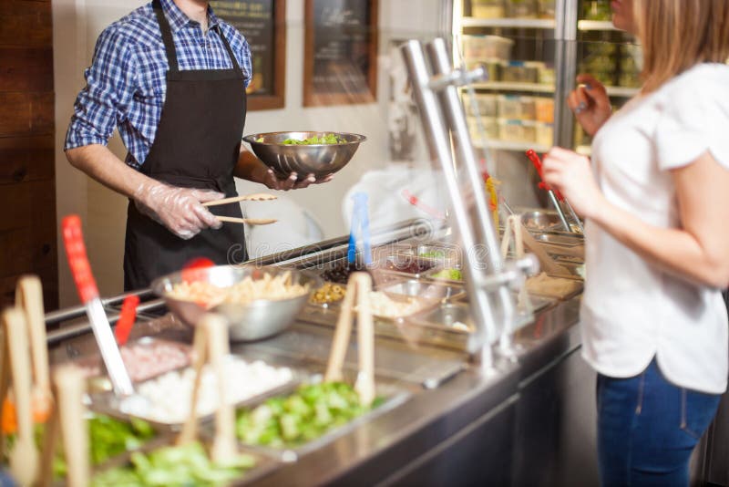 Employee Making Salad for a Customer Stock Photo - Image of adult ...