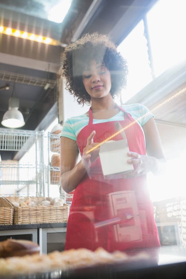 Employee in Red Apron Holding Box Stock Image - Image of occupation ...