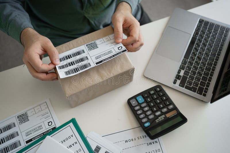 The Employee Sticks Barcode on the Parcel and Notes in the Clients ...