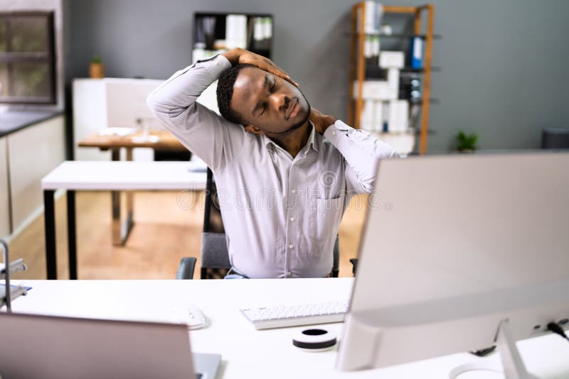 Employee Stretching at Office Desk Stock Image - Image of caucasian ...
